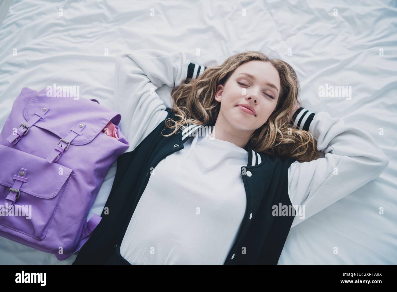 Photo of sweet pretty teen girl lying bed sleeping relax wear stylish ...