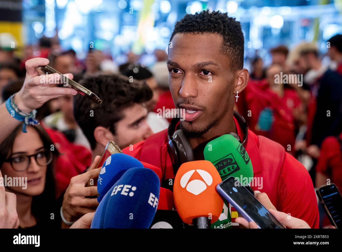 Triple jump champion Jordan Diaz attends to the media upon her arrival ...