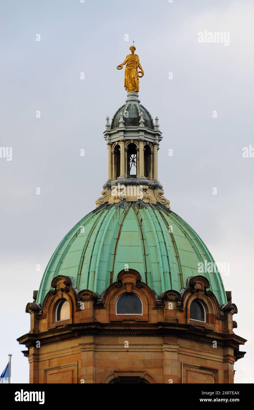 Ornate dome with golden statue atop historic Edinburgh building under ...