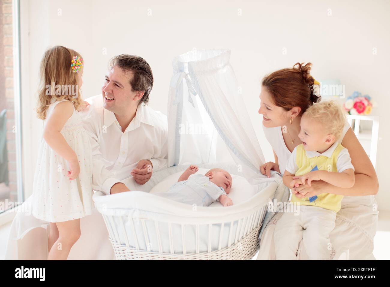 Big family with four kids in white bedroom. Parents and kids standing ...
