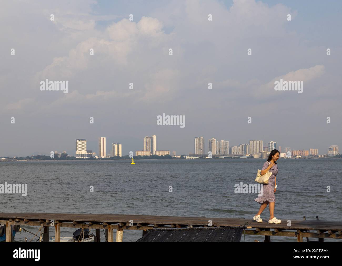 Asian tourist in Chew Jetty, Penang island, George Town, Malaysia Stock ...