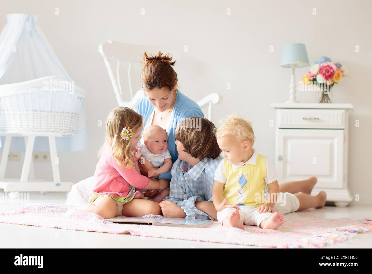 Big family with four kids in white bedroom. Parents and kids standing ...
