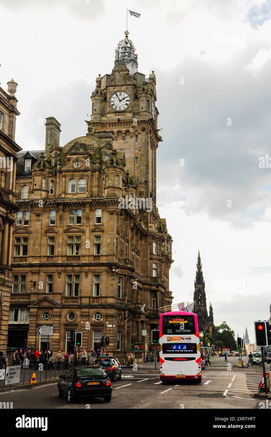 View of busy street in Edinburgh with iconic clock tower and double ...