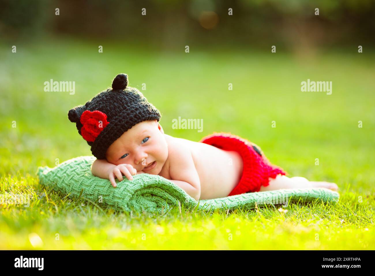 Baby in cute dress up costume. Newborn in garden. Adorable infant ...