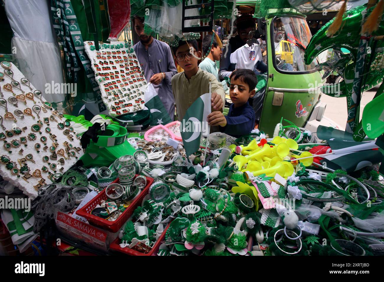 Pakistani boys buy national flags in Peshawar, Pakistan, Monday, Aug ...