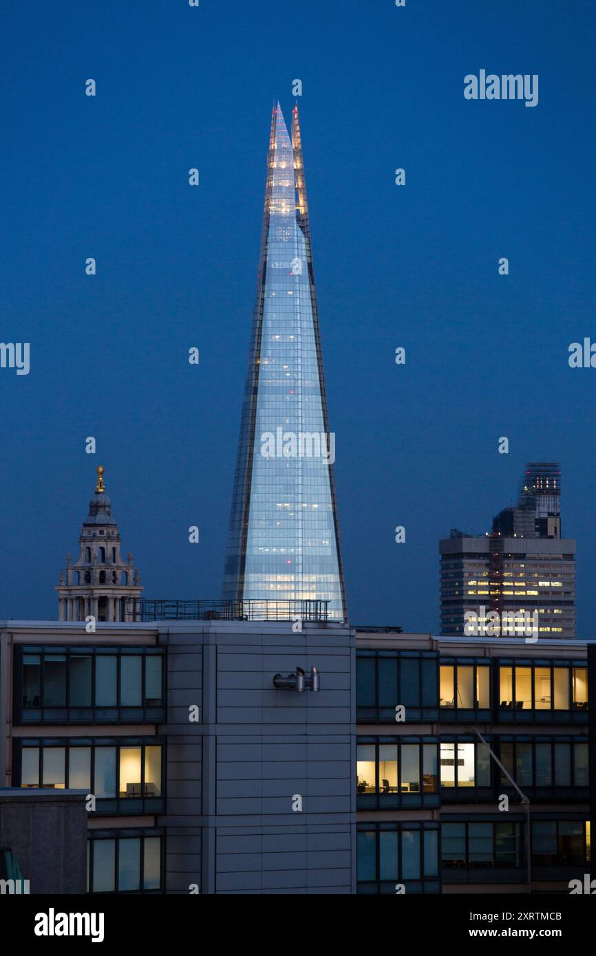 looking out over the rooftops of the city of London, and standing ...