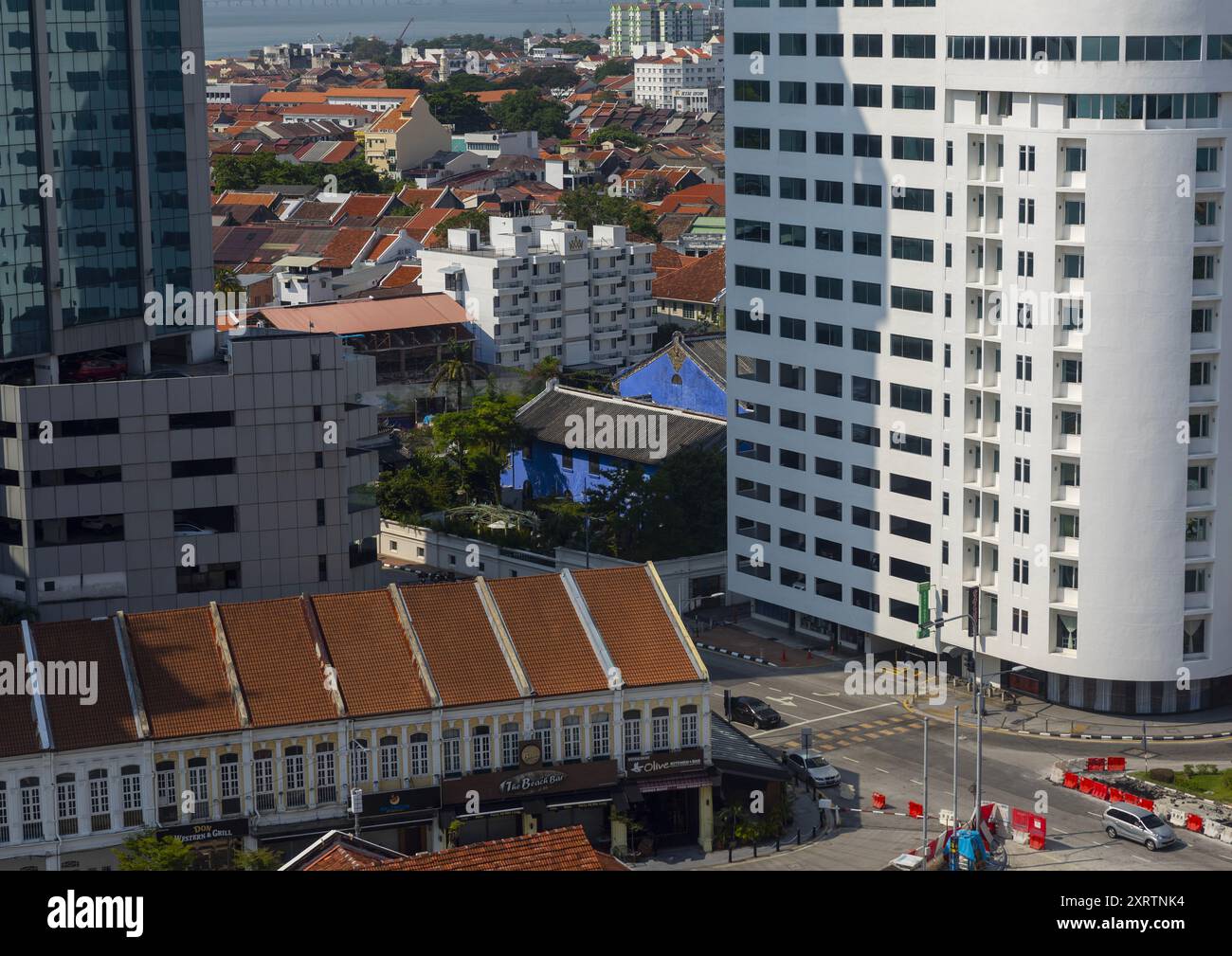 Cheong Fatt Tze Chinese Mansion in the middle of modern buildings ...