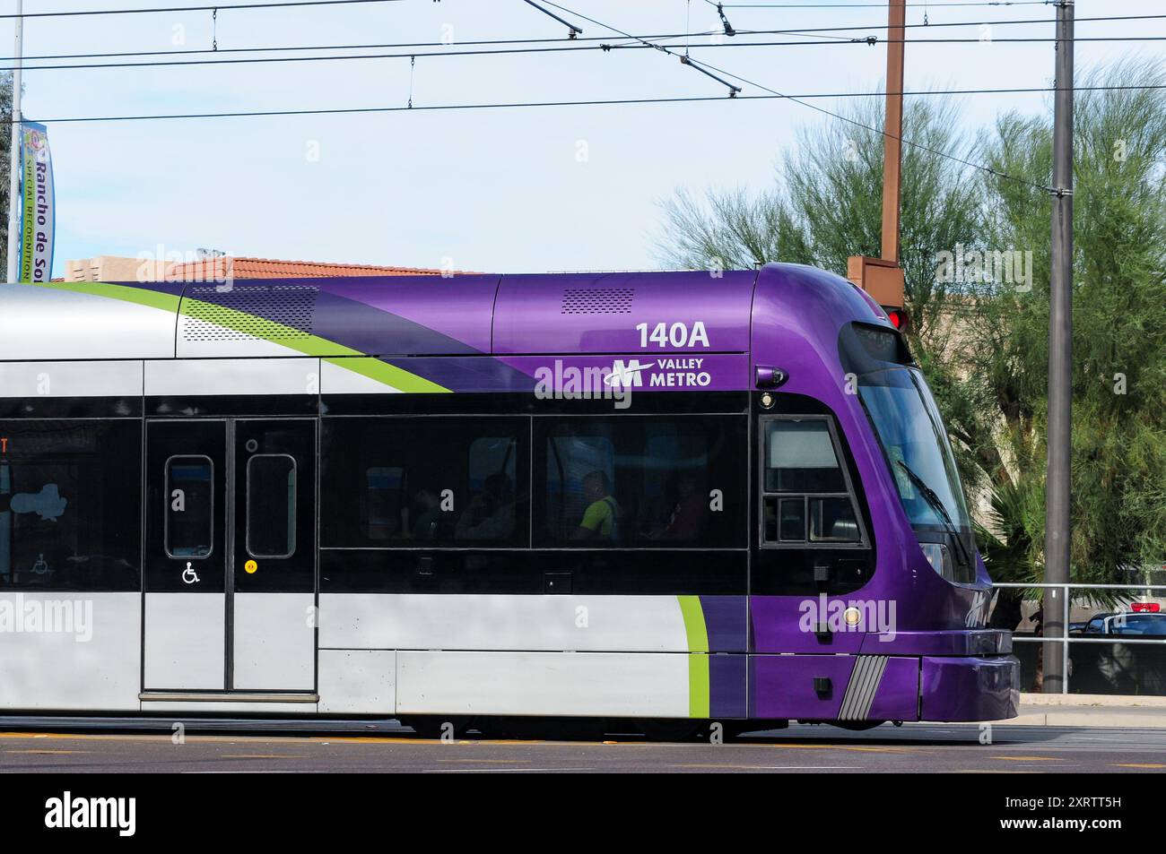 A Valley Metro Rail vehicle traveling on Main Street in Mesa, Arizona ...
