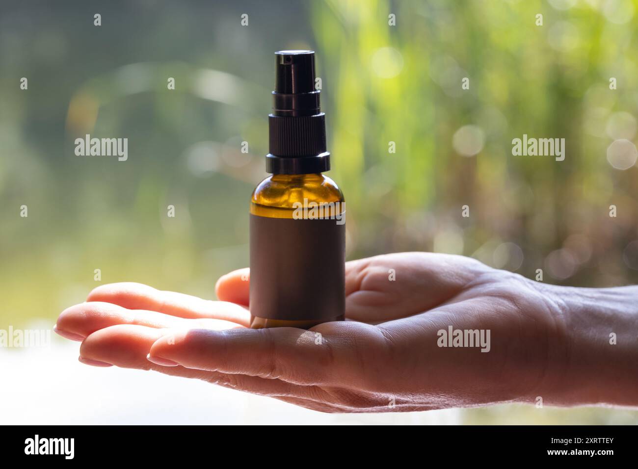 Hand Holding Cosmetic Product Mockup Stock Photo - Alamy
