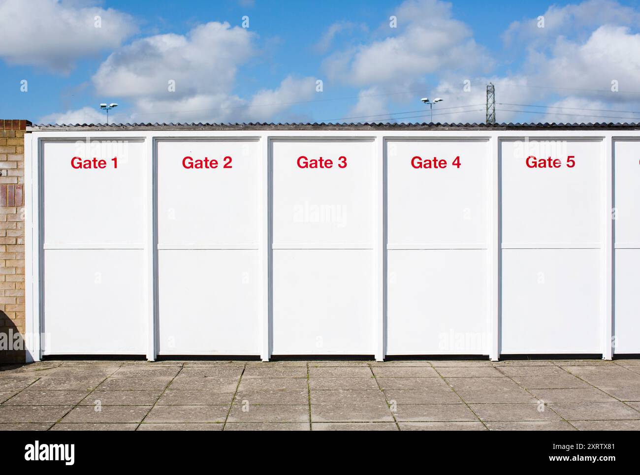 Football ground entrance with numbered gates Stock Photo - Alamy