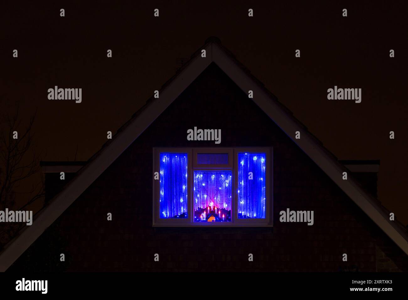House with christmas lights and decorations glowing from a bedroom ...