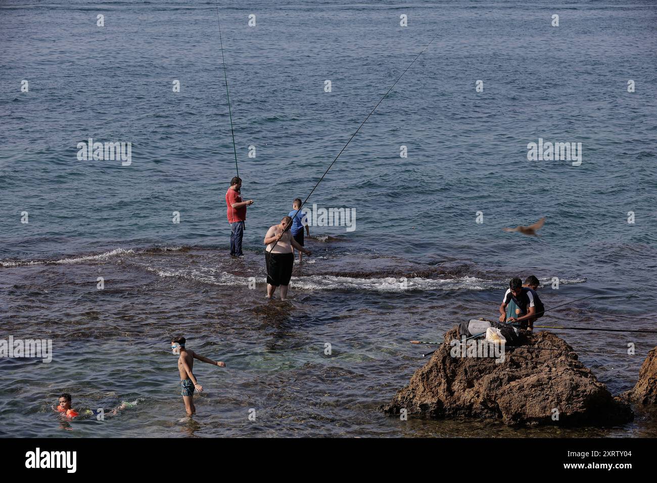 Beirut, Lebanon. 11th Aug, 2024. Men seen fishing in the Mediterranean ...