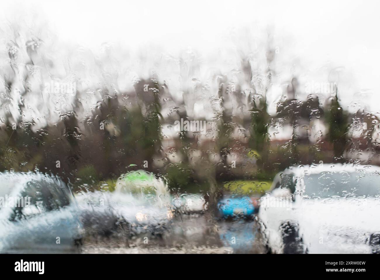 Woman looking through window rain hi-res stock photography and images ...