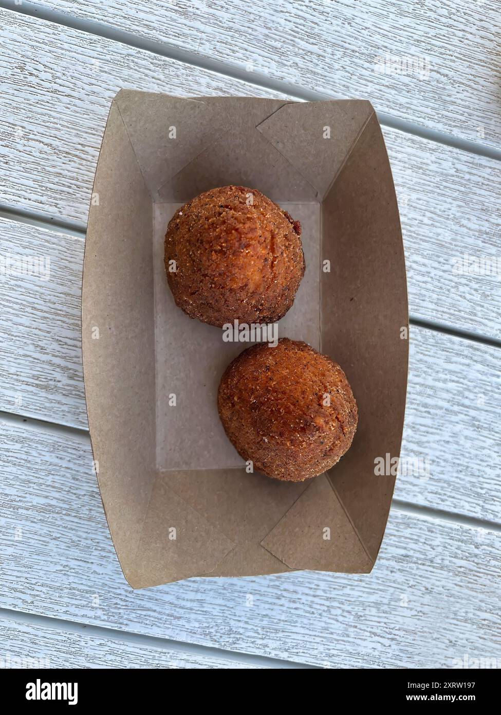 Deep fried arancini balls on rustic white background - traditional ...