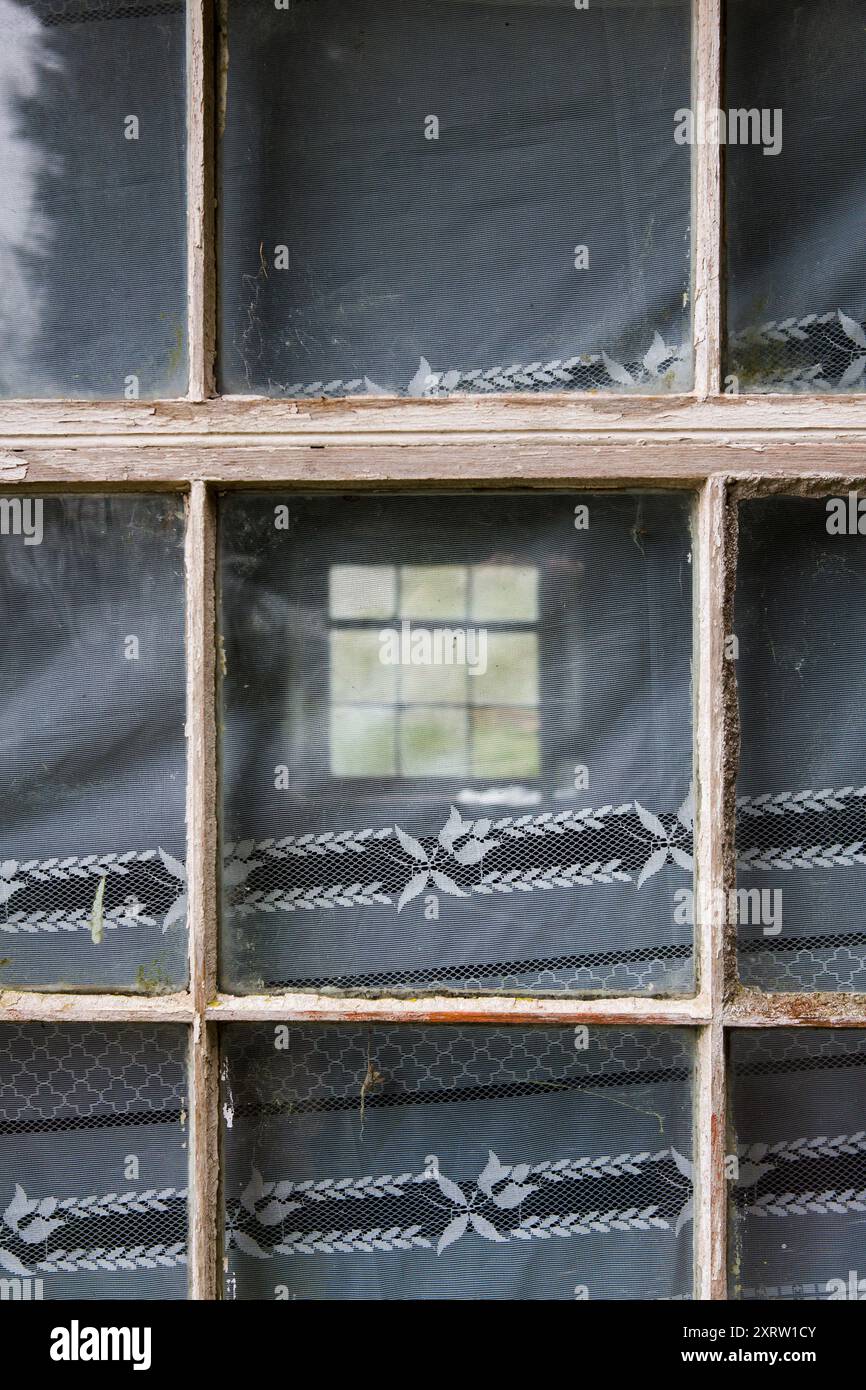 A run down deserted house in the welsh countryside with old lace ...
