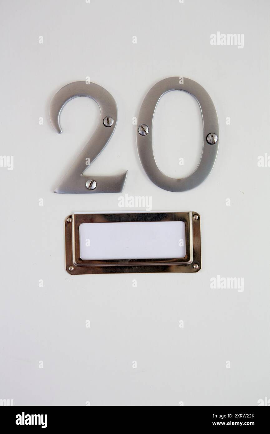 Name badge and number on the door of a patients room in an old peoples ...