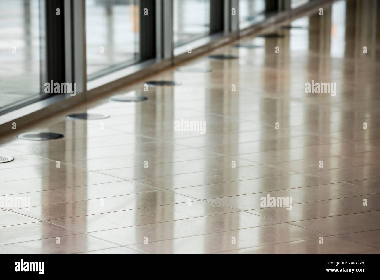 Internal view of an office complex with tiled floor, pillar walkways ...