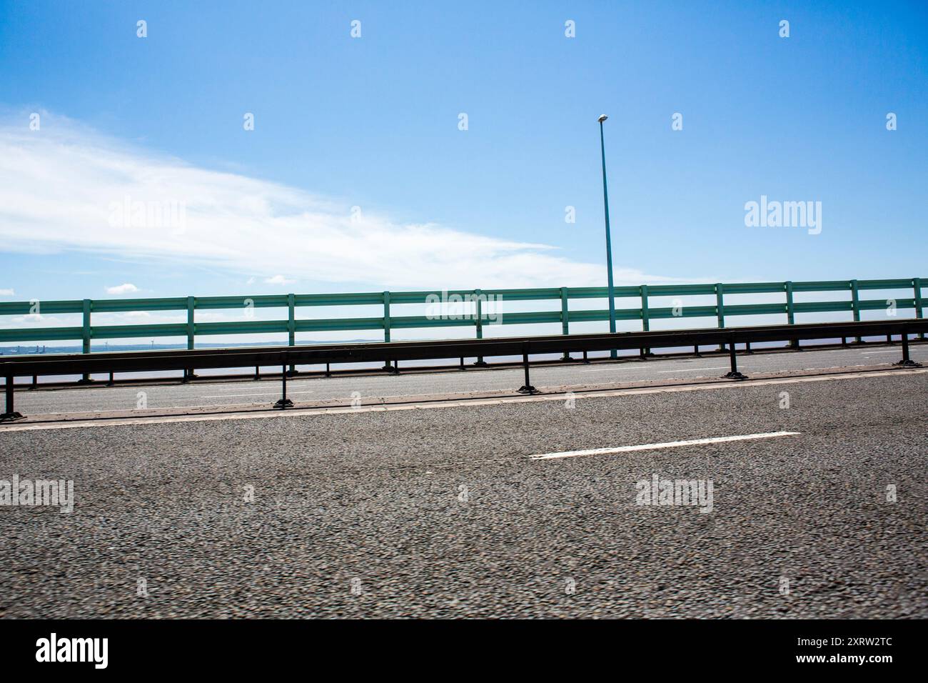 Crossing the Severn bridge from Wales to England with blue sky, road ...