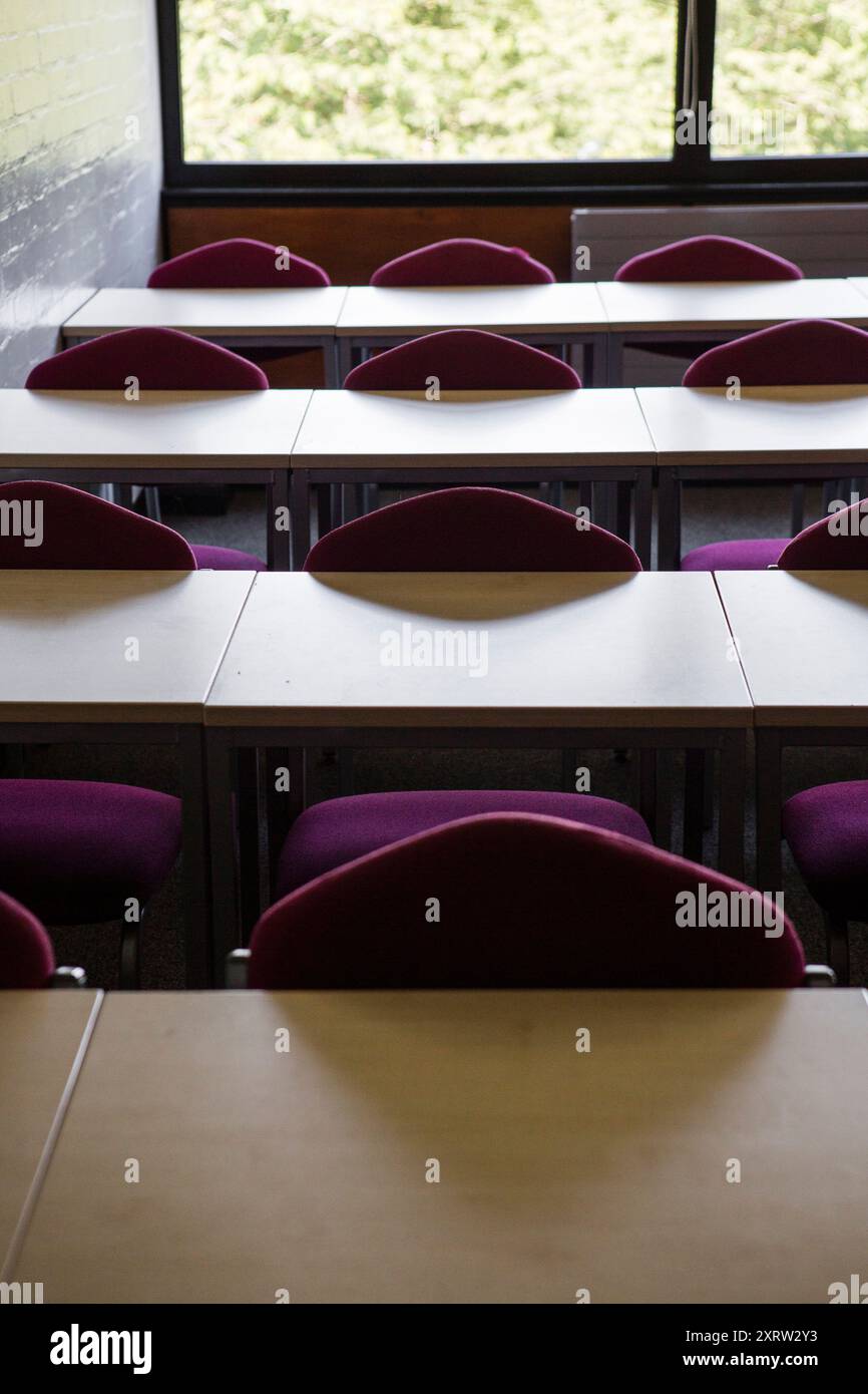 Inside a classroom or lecture room with empty rows of chairs set ...