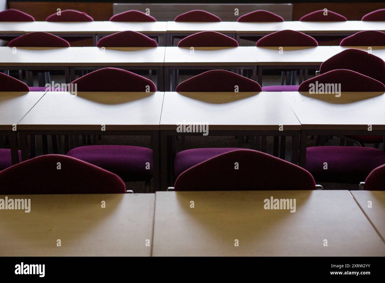 Inside a classroom or lecture room with empty rows of chairs set ...