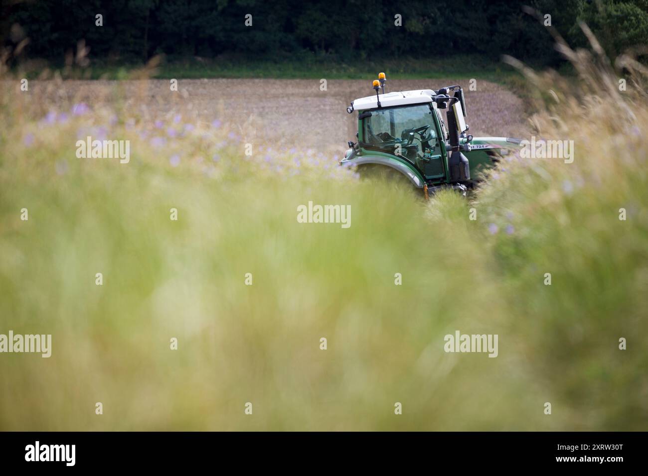 Tractors spreading muck and ploughing it in on a farmer's field Stock ...