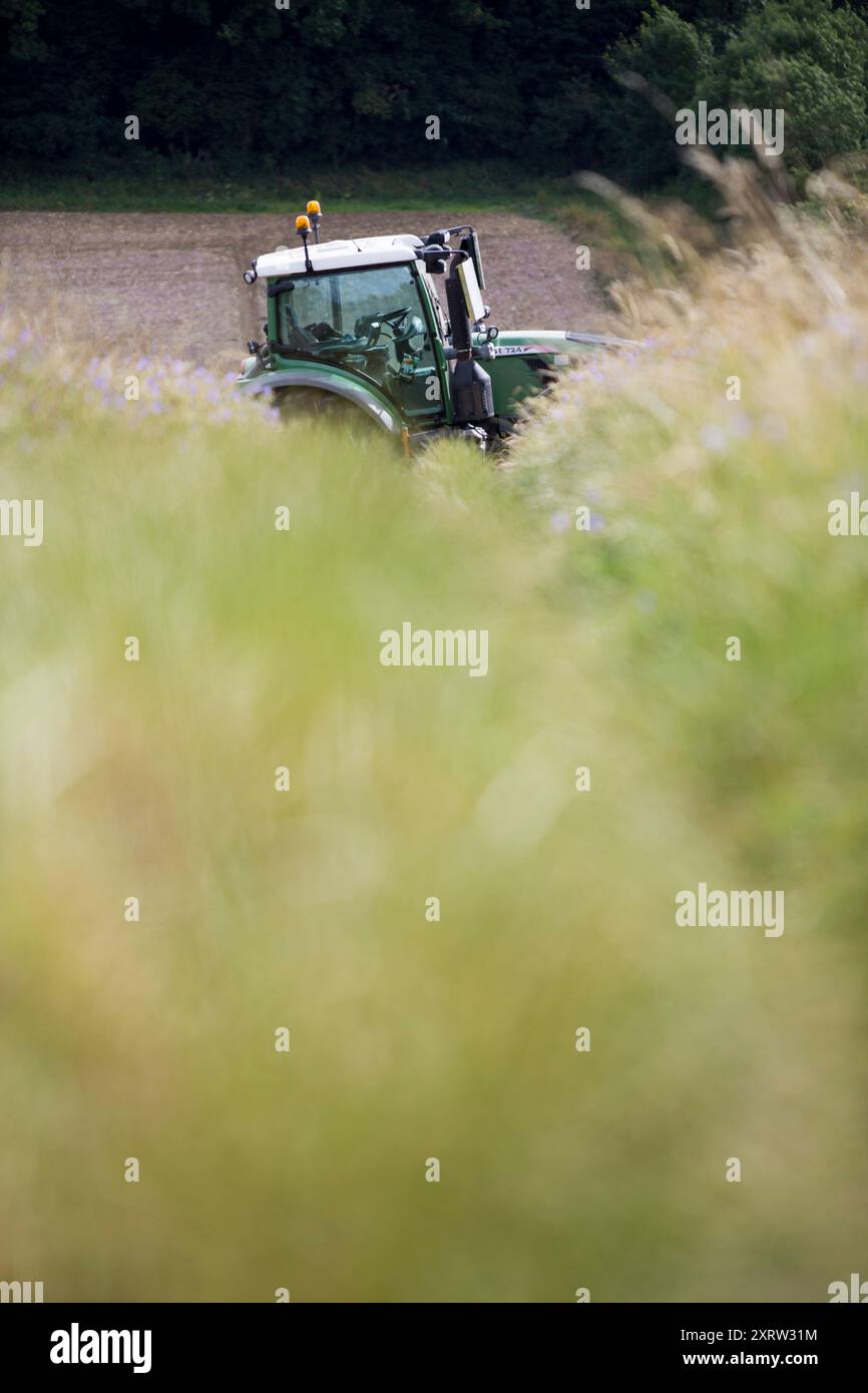 Tractors spreading muck and ploughing it in on a farmer's field Stock ...