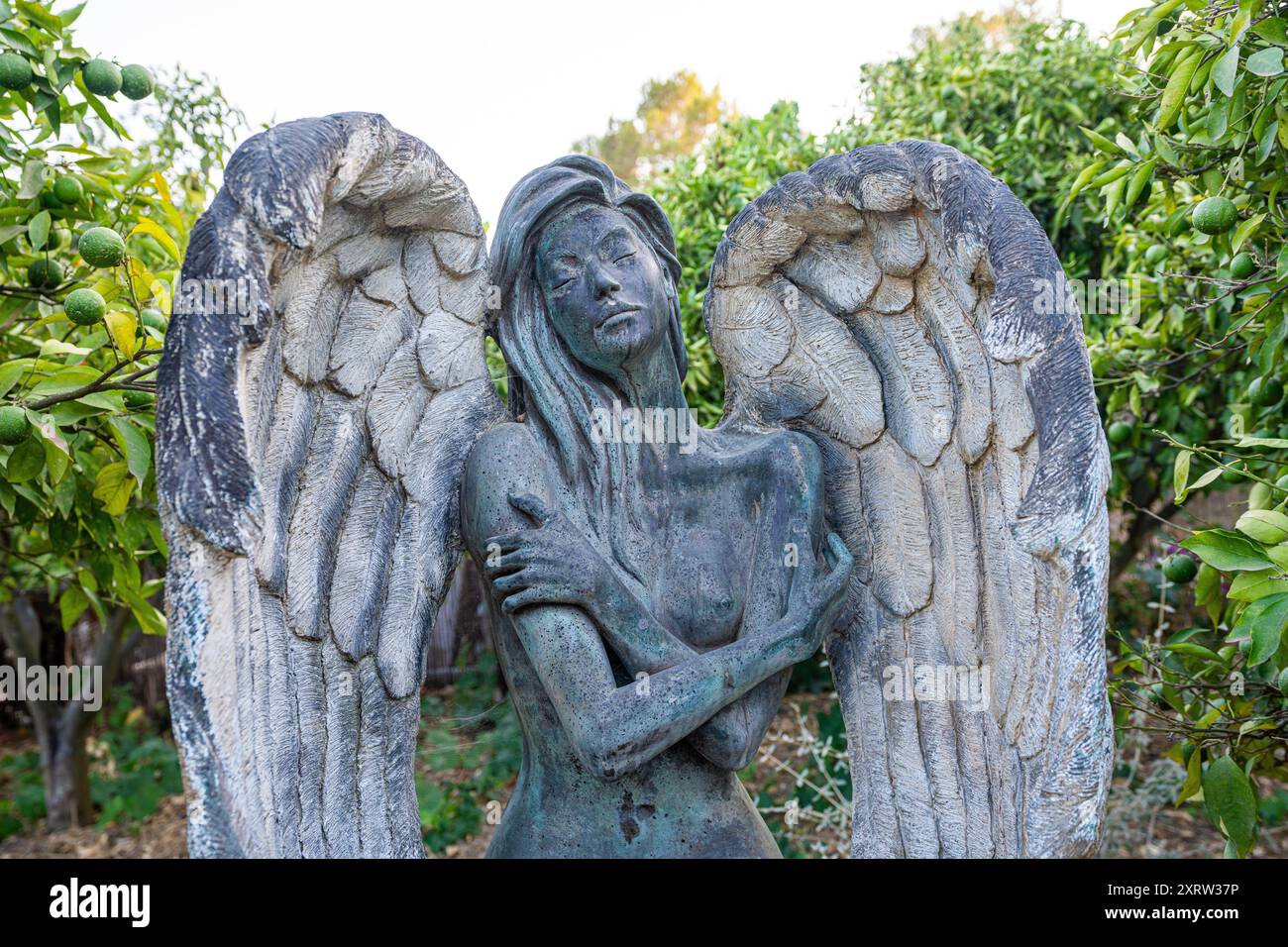 stone angel with in a hug pose with big wings upper body shot in ...