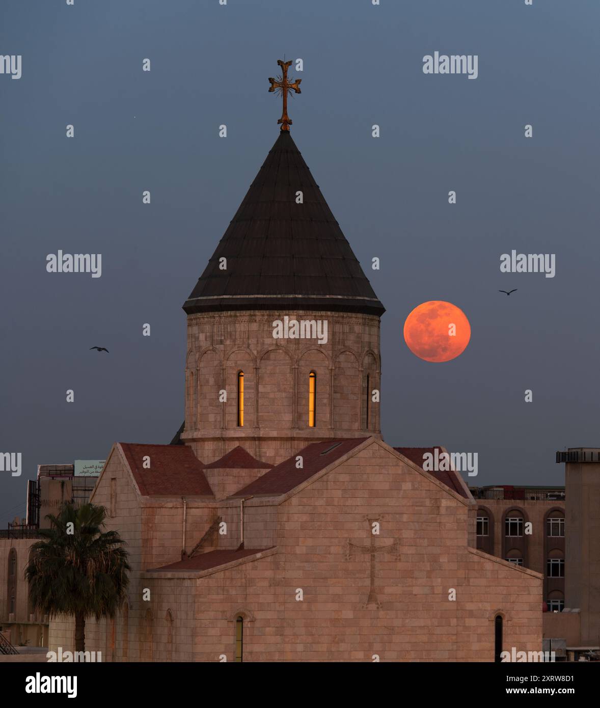 Full moon rises behind "Our Lady of the Rosary" Church in Baghdad Stock ...
