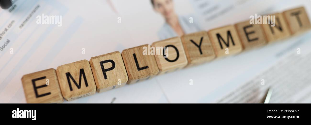 Word employment collected with wooden cubes, pen and stamp approved on ...