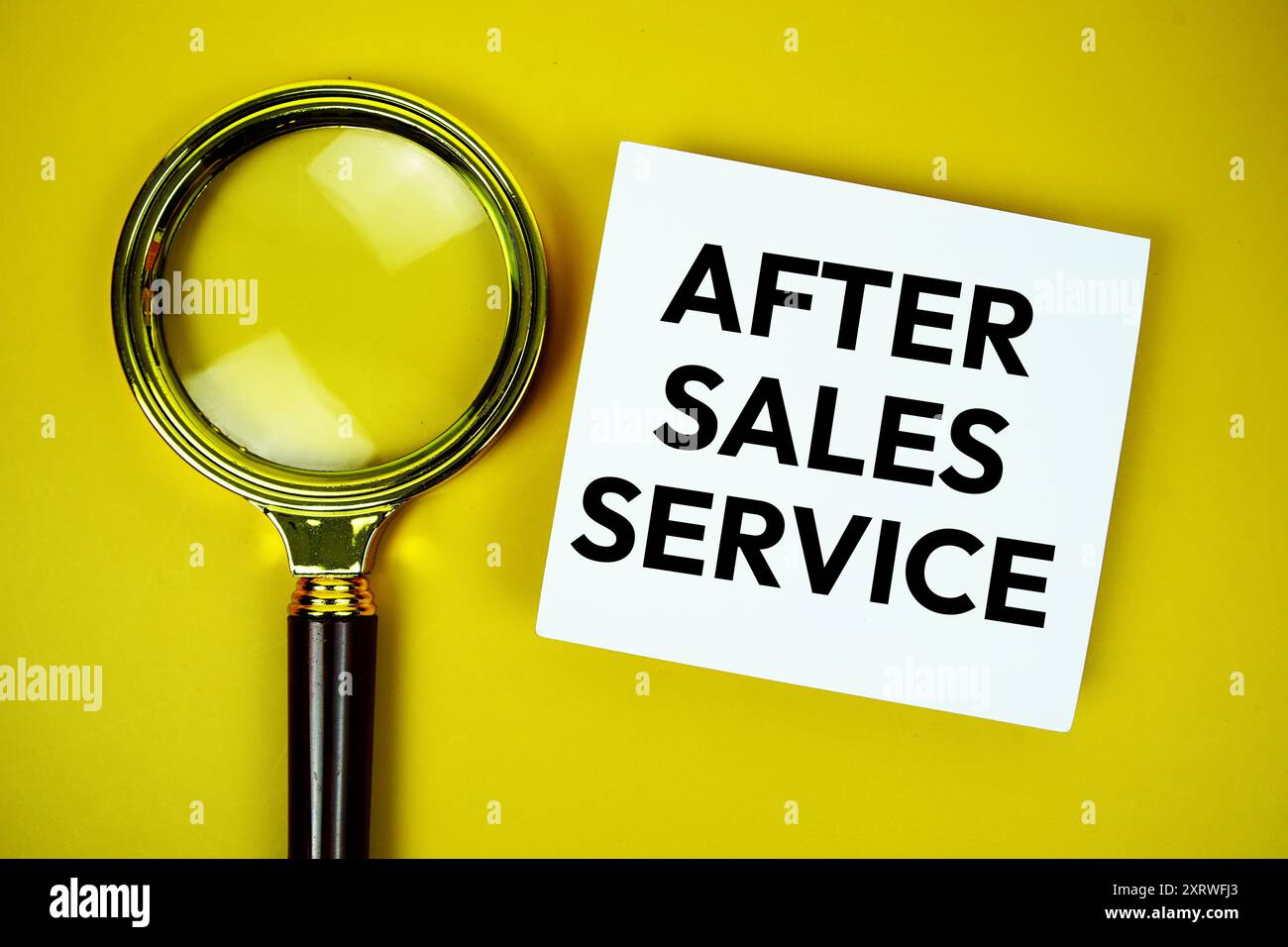 After sales service text message written on paper note with magnifying ...