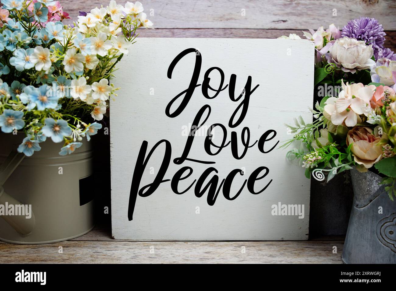 Joy Love Peace quotes text with flowers decoration on wooden background ...