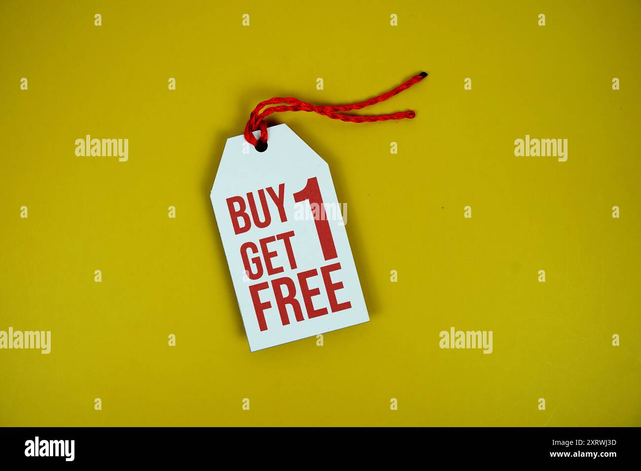 Buy 1 Get 1 Free on price tag with wooden clothes hanger and trolley ...