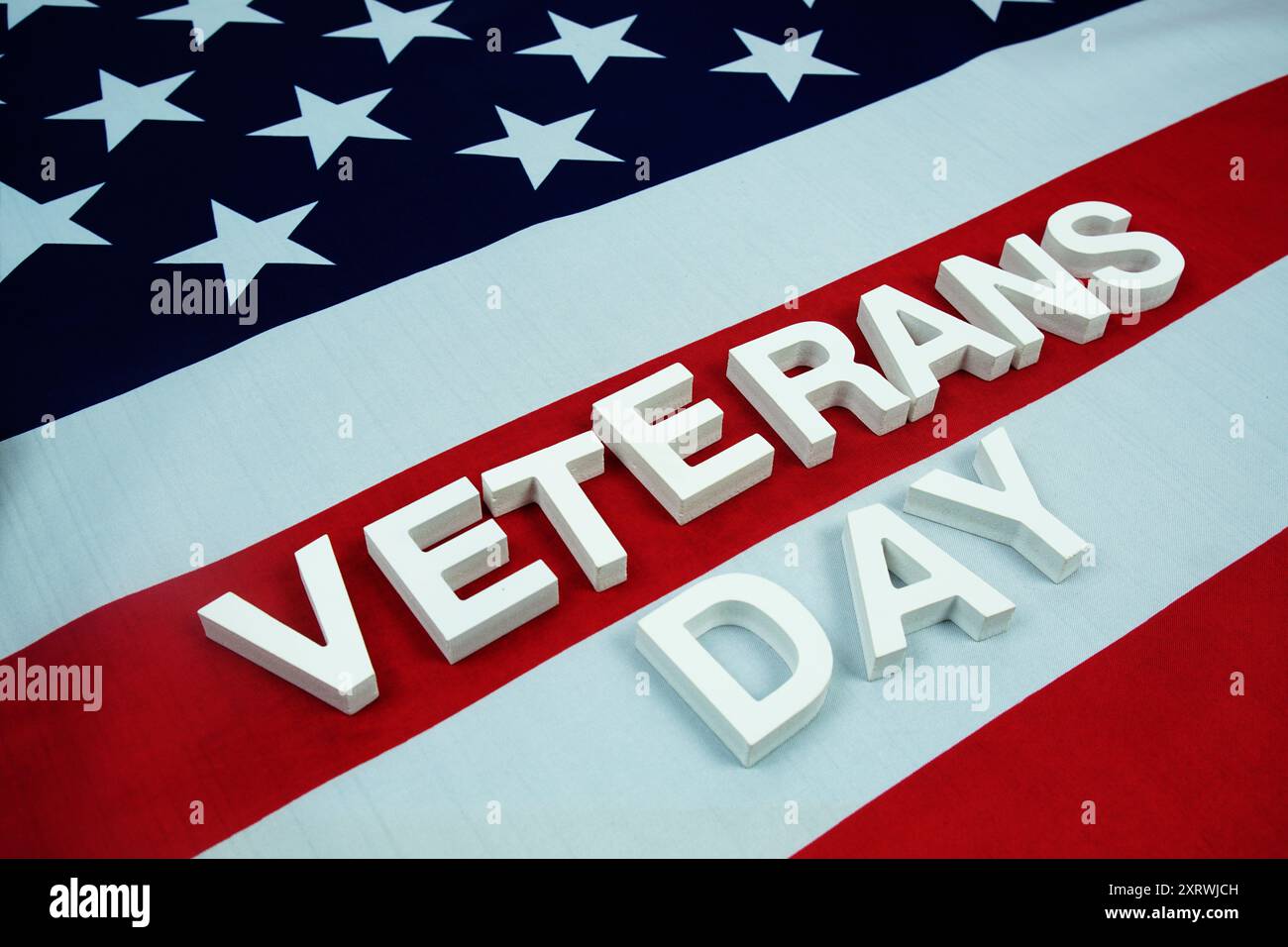 Happy Veterans Day alphabet letters and American flag background Stock ...