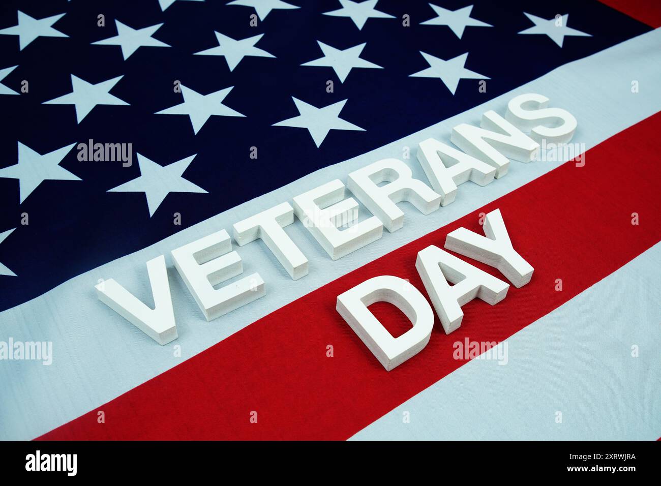 Happy Veterans Day alphabet letters and American flag background Stock ...