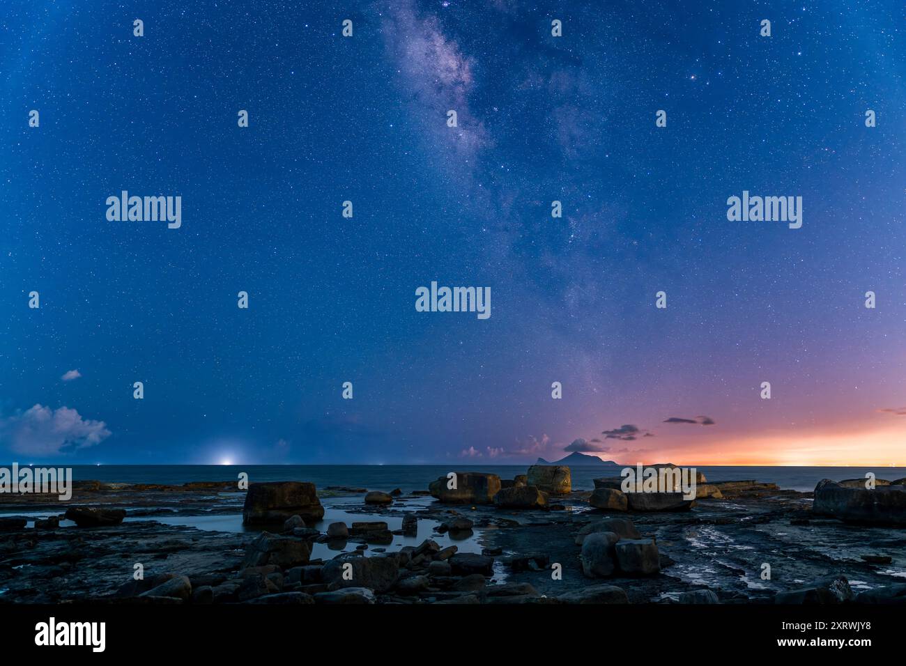 Nighttime seaside view featuring Turtle Island, with a stunning galaxy ...