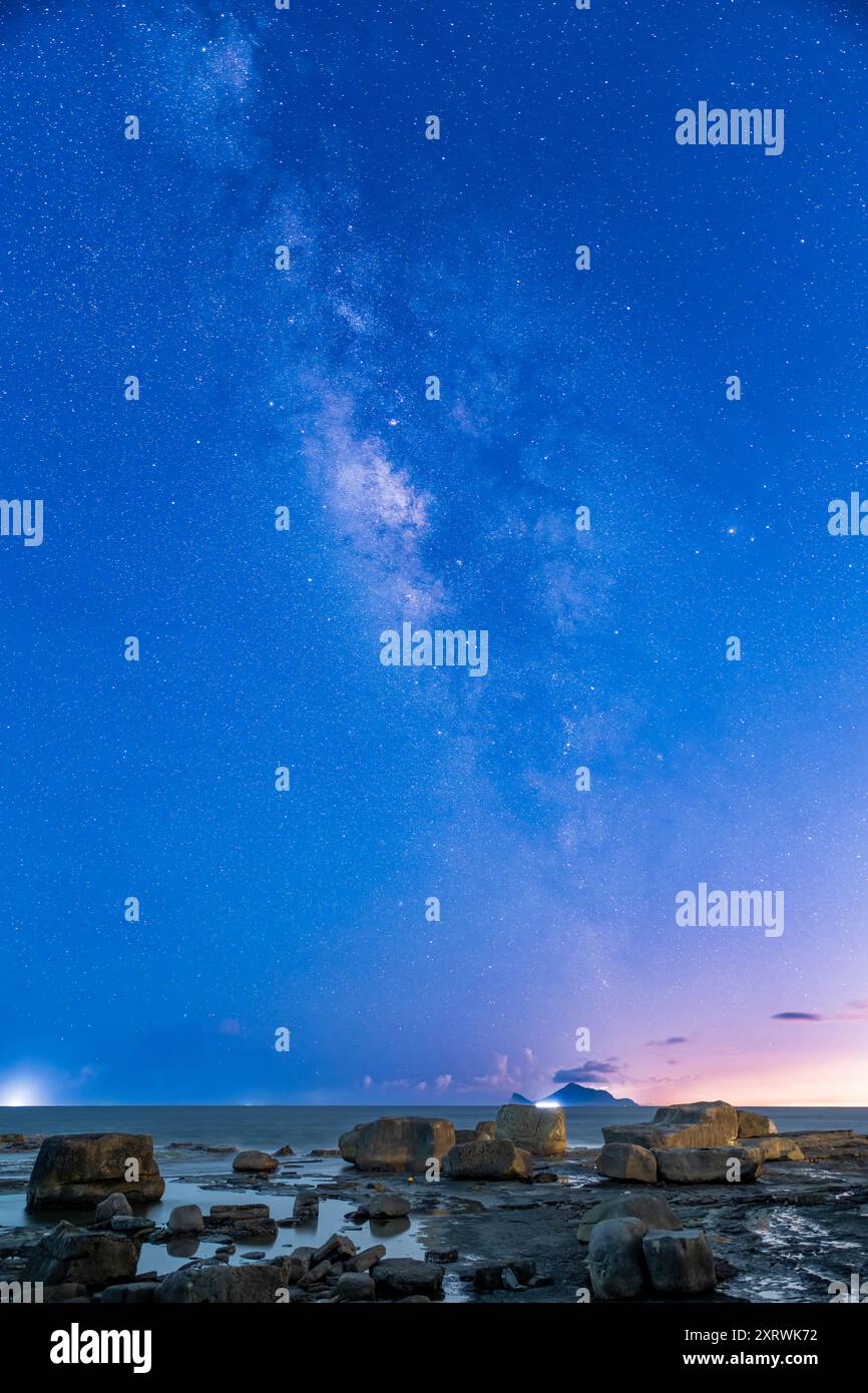 Nighttime seaside view featuring Turtle Island, with a stunning galaxy ...