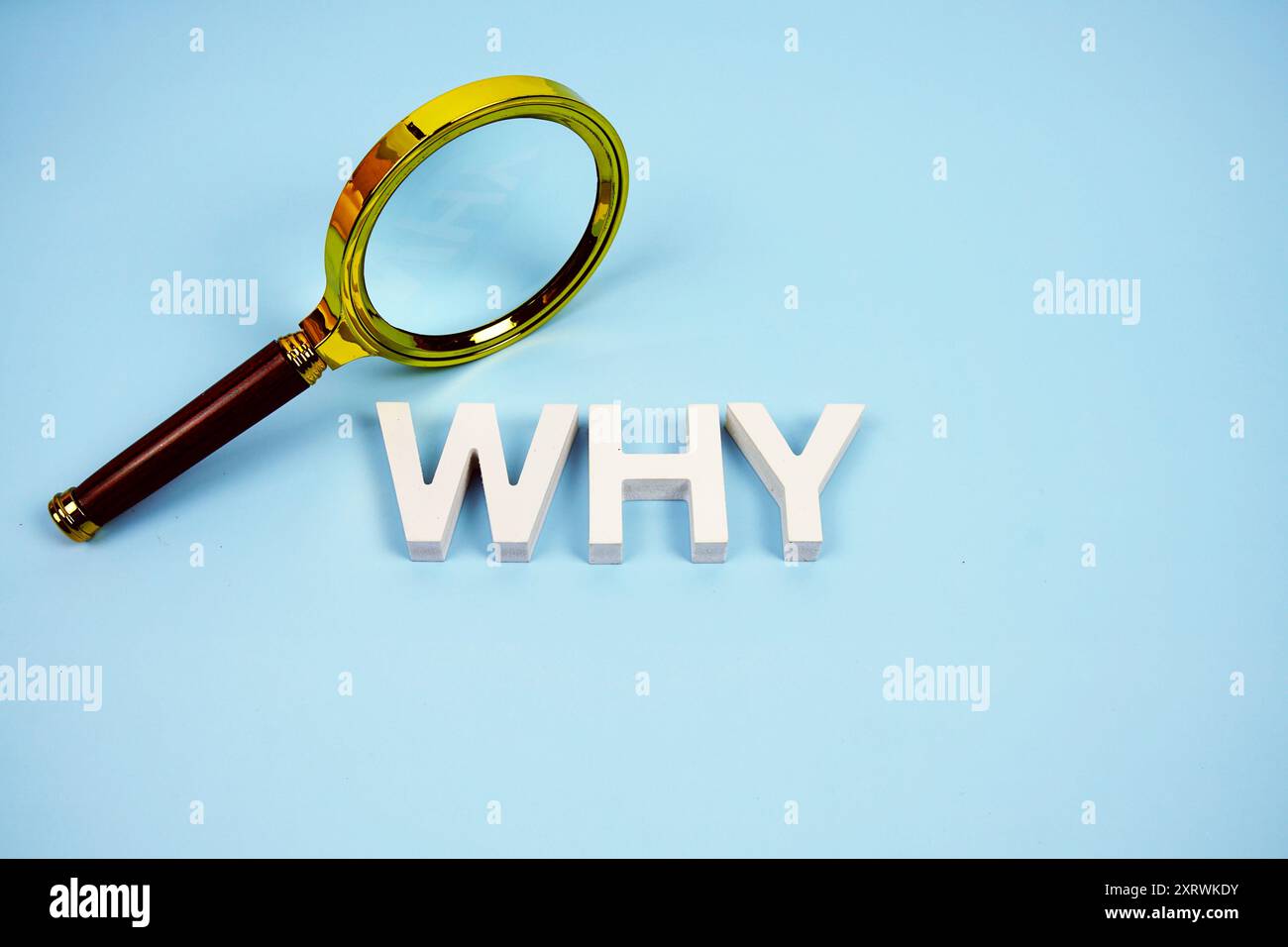 Why? word with magnifying glass on blue background Stock Photo - Alamy