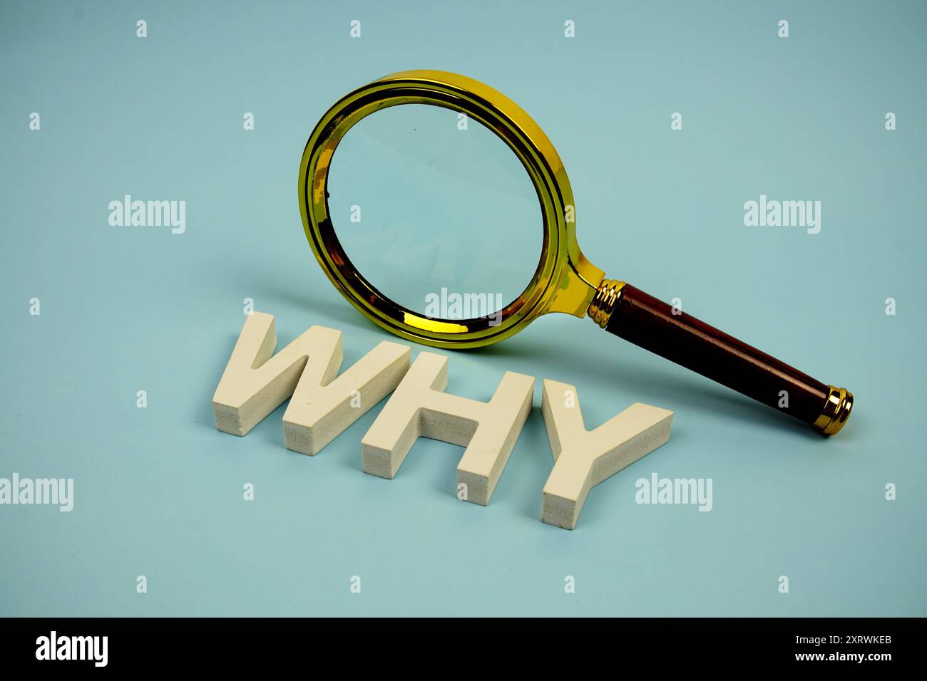 Why? word with magnifying glass on blue background Stock Photo - Alamy