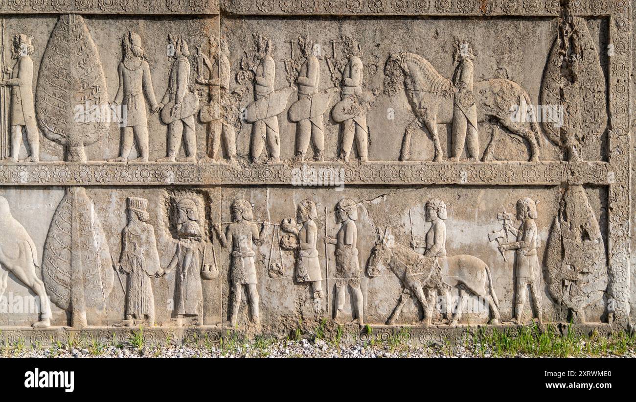 Persepolis, Iran - 3 May 2019: Carvings on a wall at ruins of ...