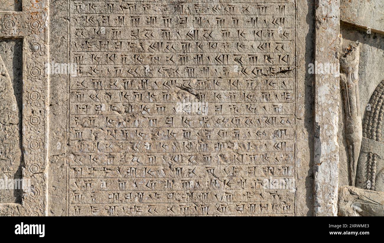 Persepolis, Iran - 3 May 2019: Carvings of ancient writing and letters ...