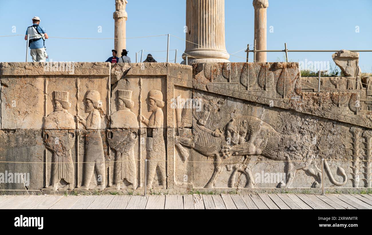 Persepolis, Iran - 3 May 2019: Carvings on a wall at ruins of ...