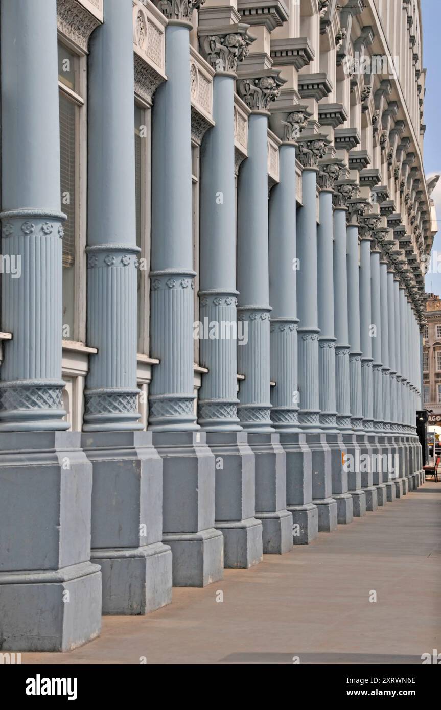 Telephoto lens exaggerates closeness long line of columns & plinths on ...