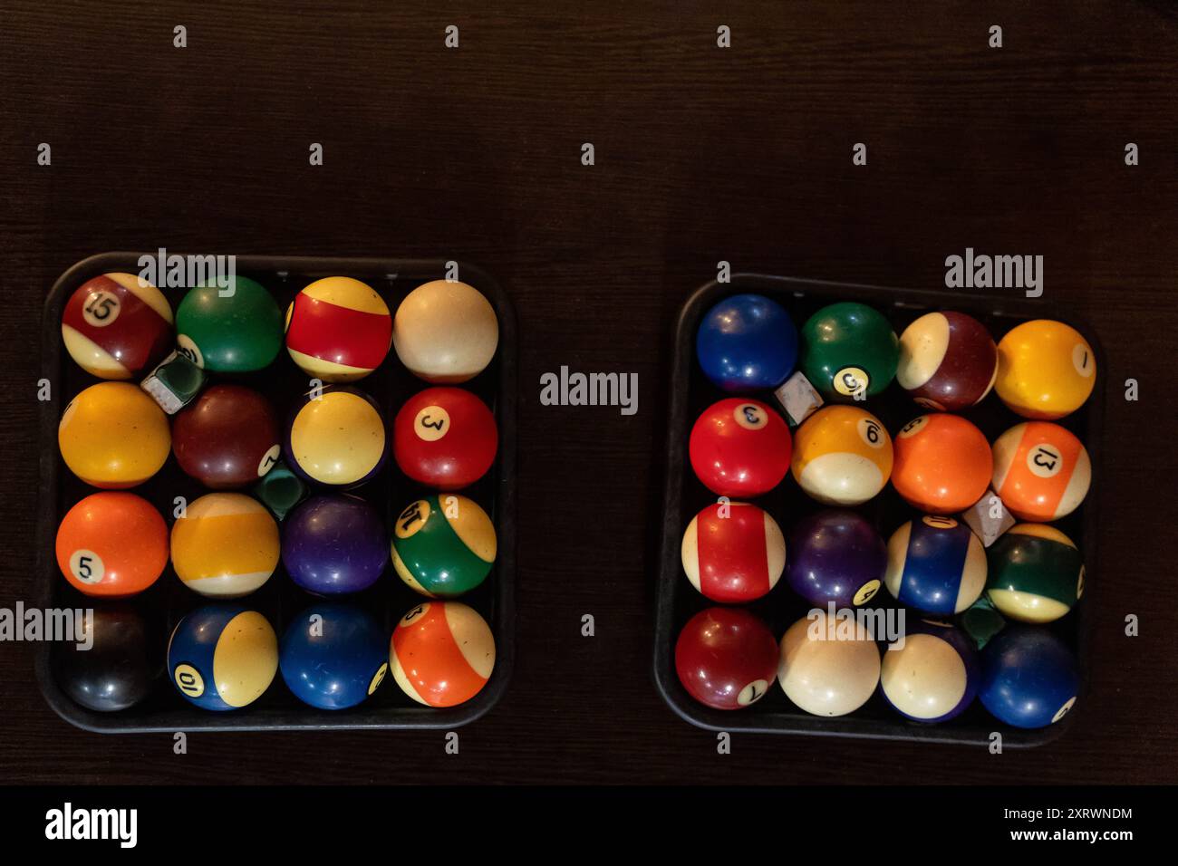 Billiard balls neatly arranged in two trays on a tabletop Stock Photo ...