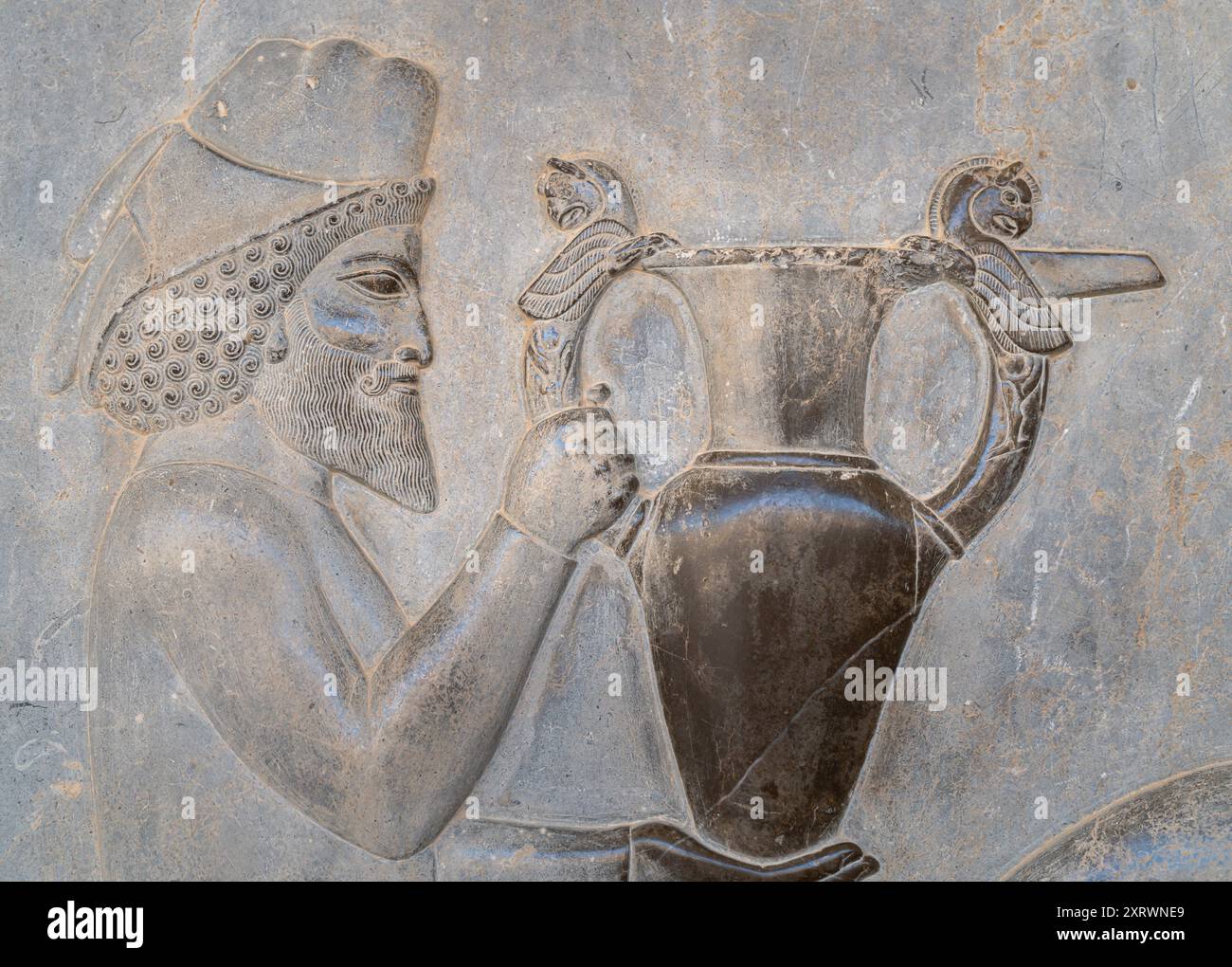 Persepolis, Iran - 3 May 2019: Carvings on a wall at ruins of ...