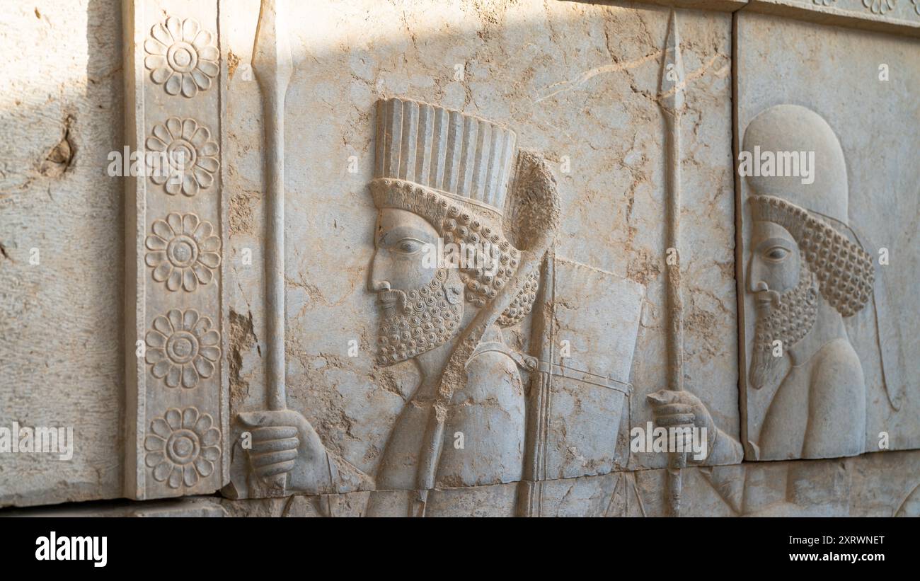 Persepolis, Iran - 3 May 2019: Carvings on a wall at ruins of ...
