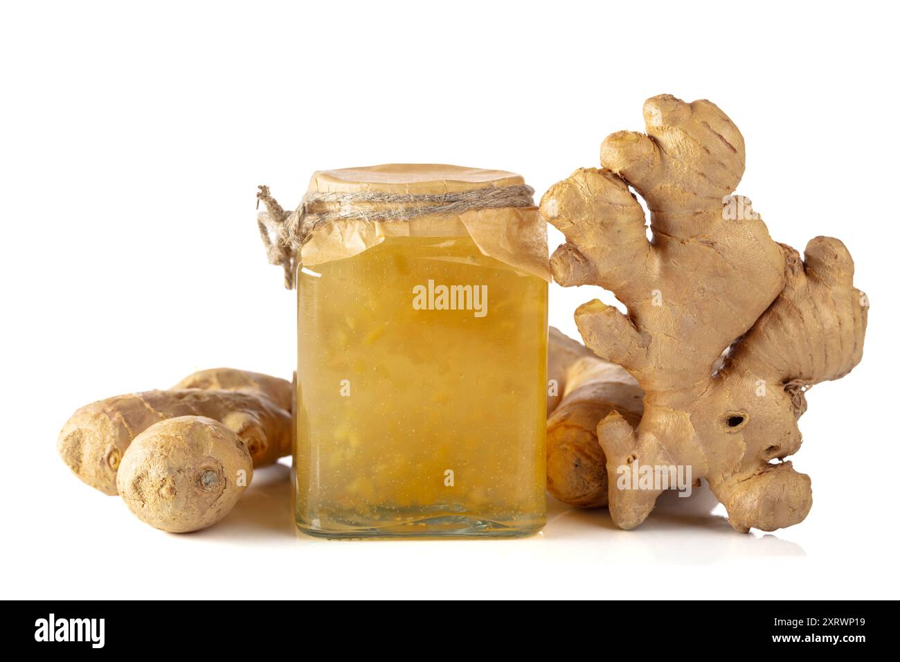 Ginger jam in small square jar and fresh ginger isolated on a white ...