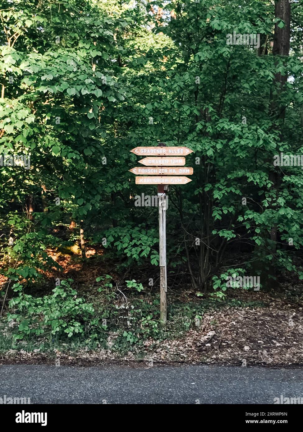 A signpost with four arrows pointing in different directions. The ...