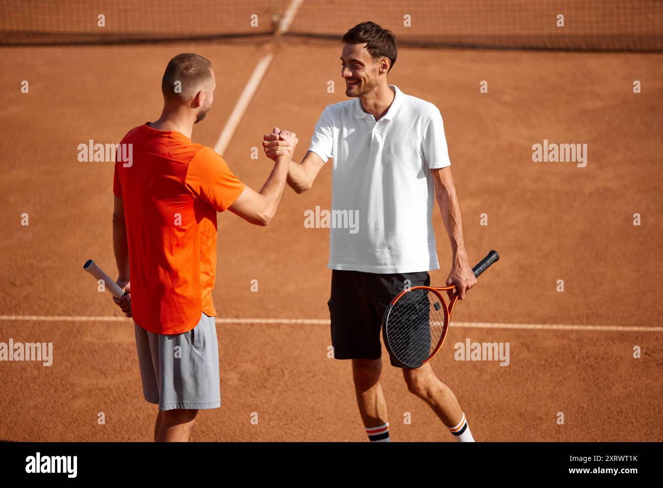 Tennis players, positive respectful men, exchanging congratulatory ...