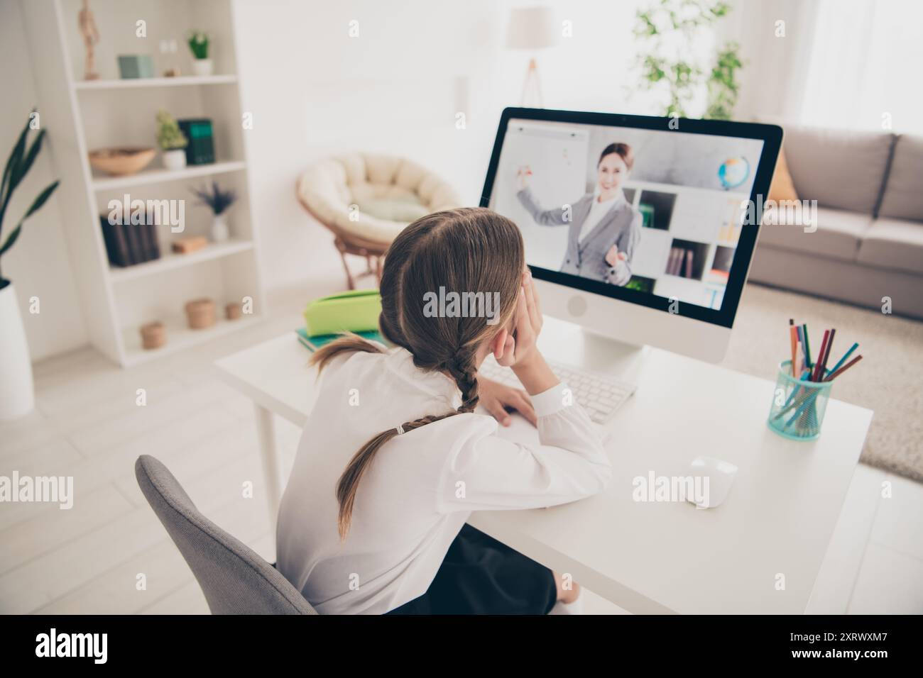 Photo of small girl study watch computer screen teacher desktop ...