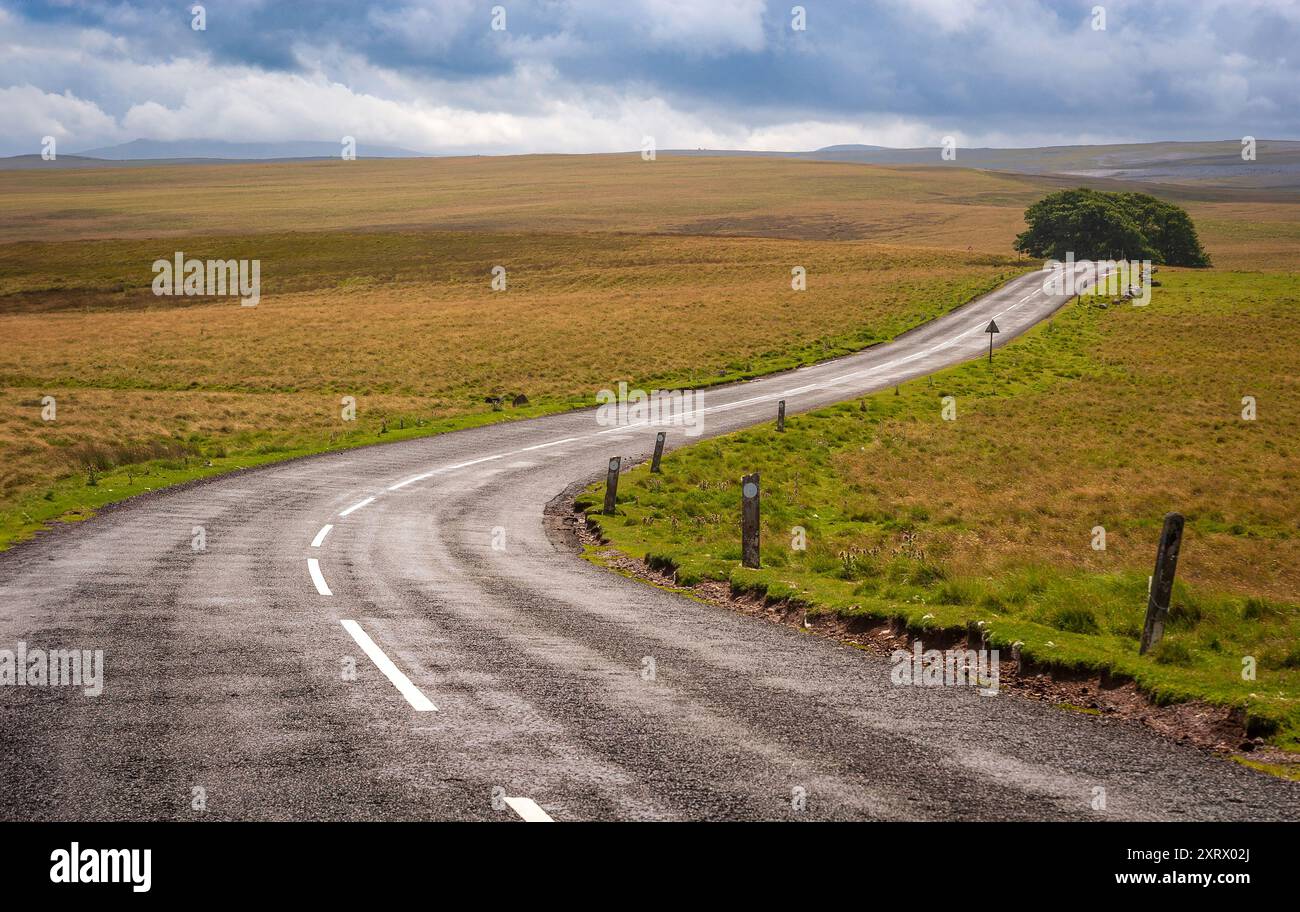 The long and winding road. A moorland road in the north of England with ...